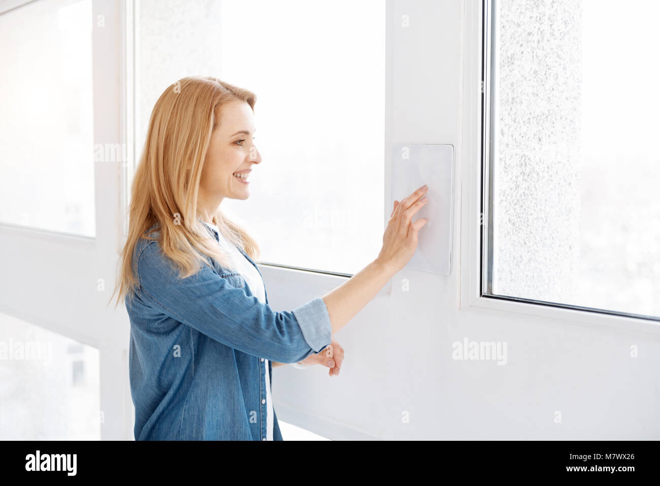 Joyful happy woman living in the smart house Stock Photo - Alamy