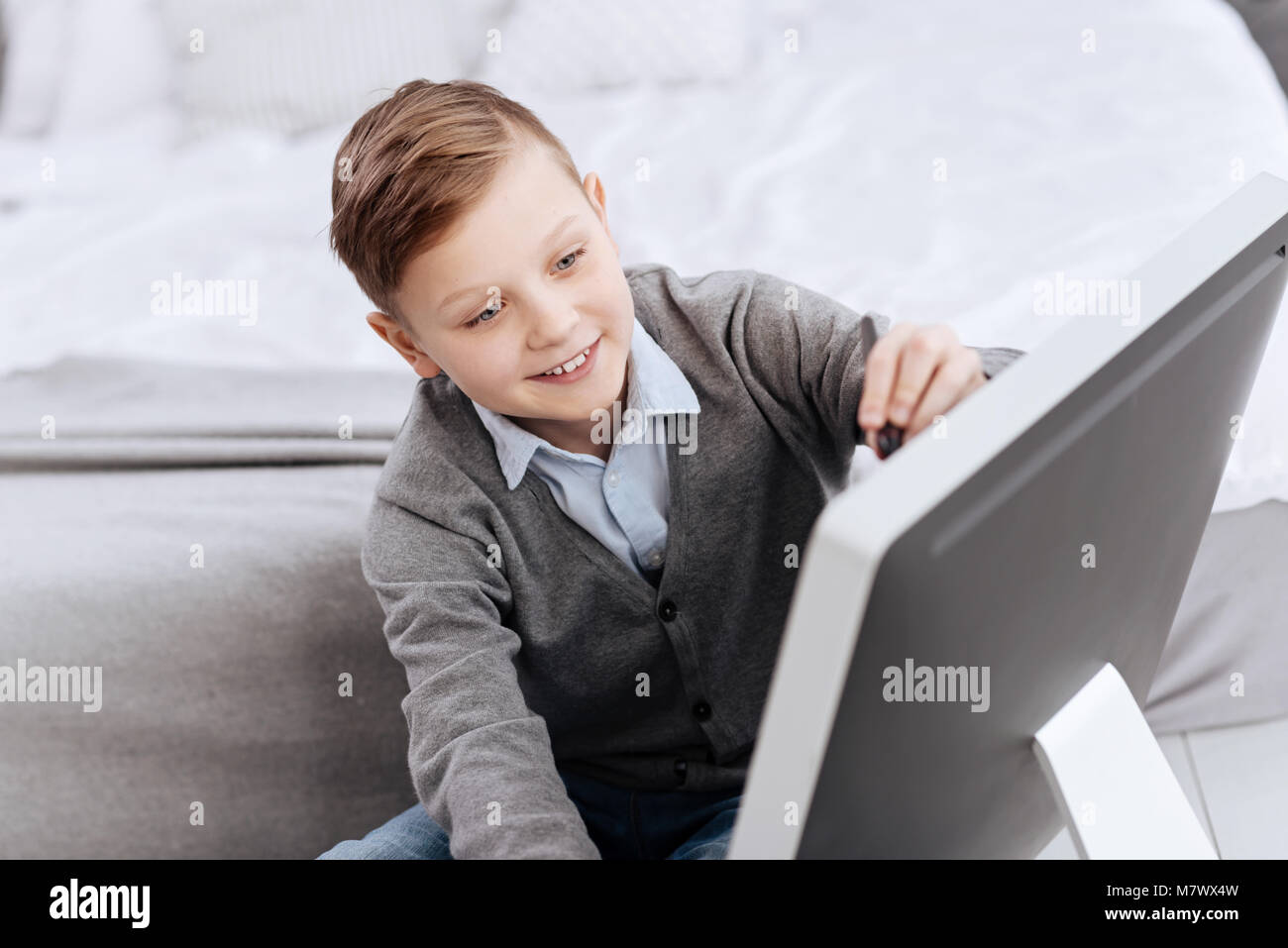 Positive nice boy being in a good mood Stock Photo - Alamy