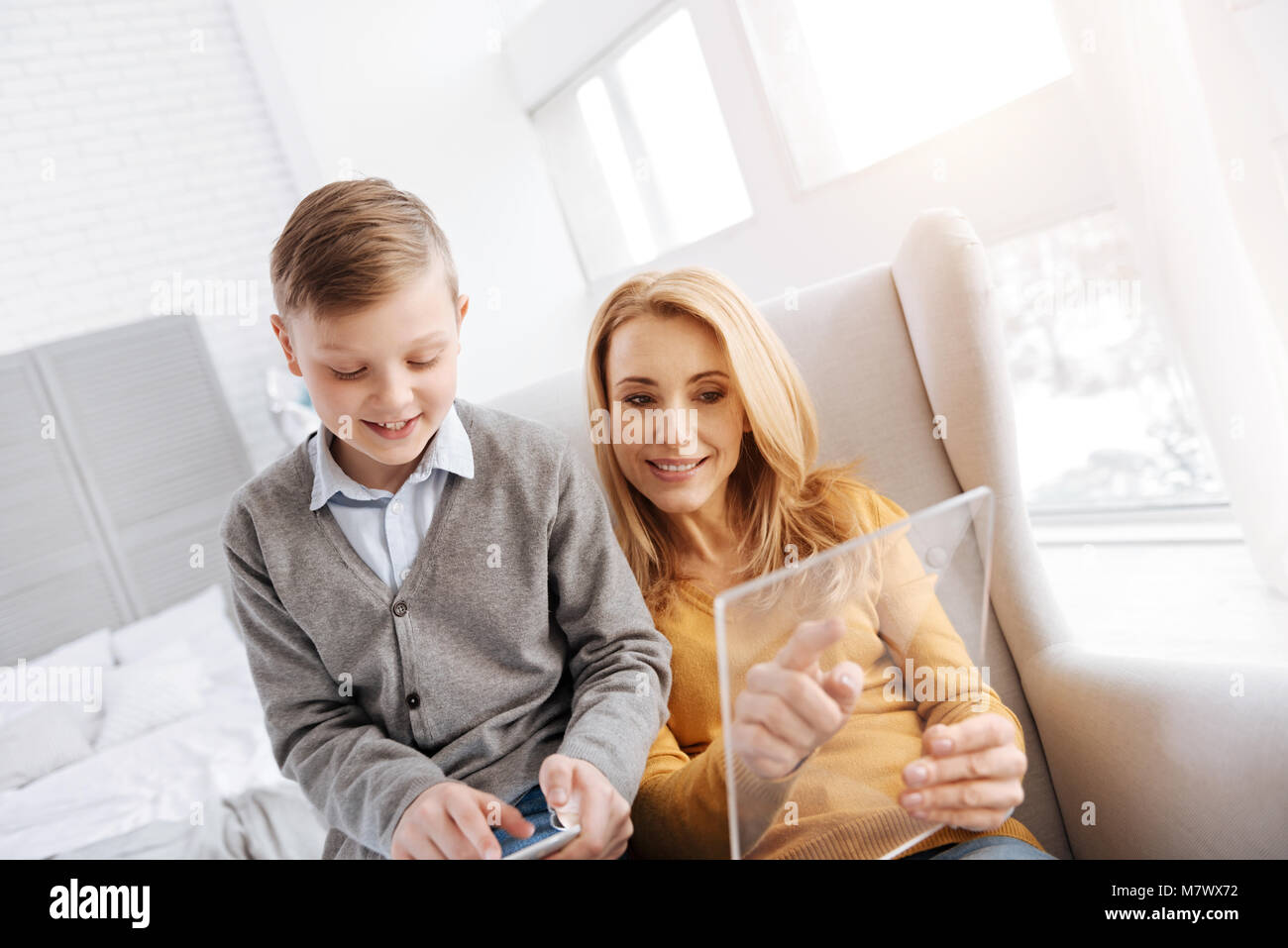 Nice positive woman using modern technology Stock Photo - Alamy Nice positive woman using modern technology Stock Photo - Alamy
