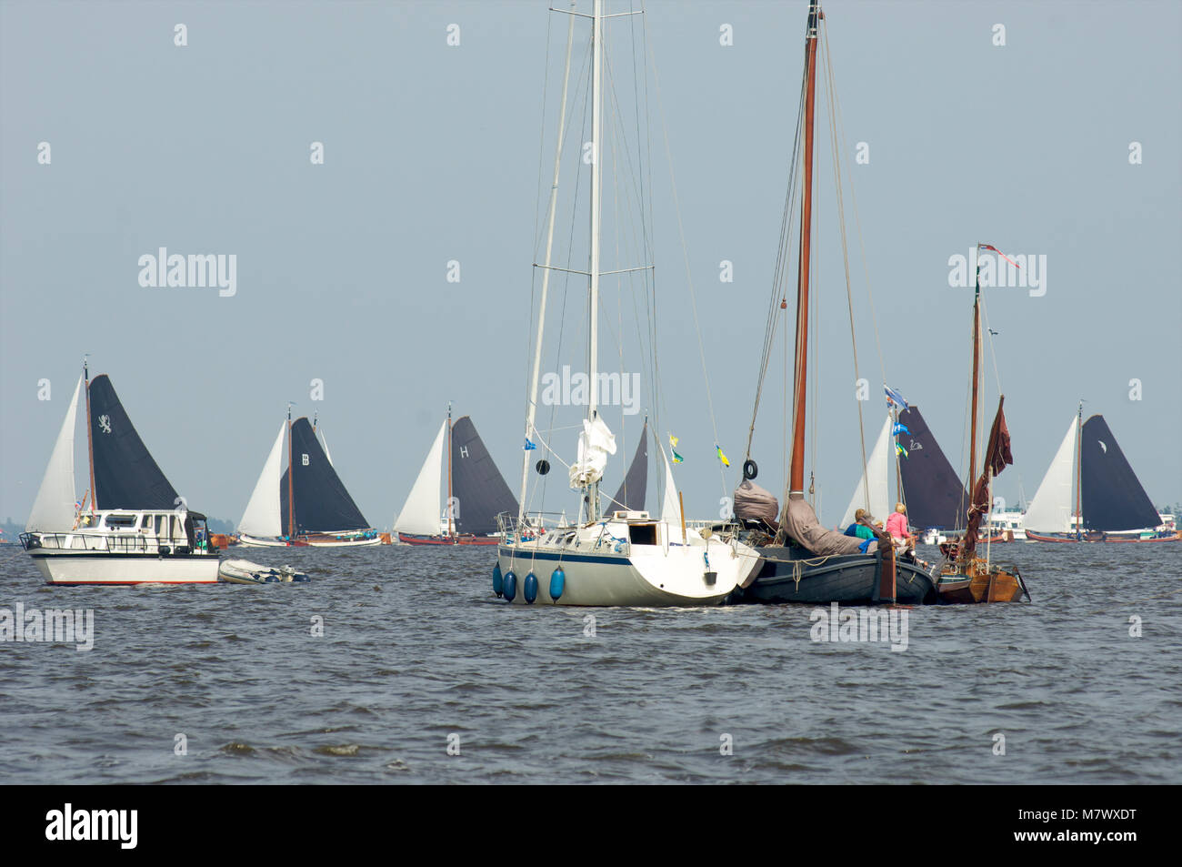 A traditional sailing race with classic Dutch wooden flat-bottemend ...