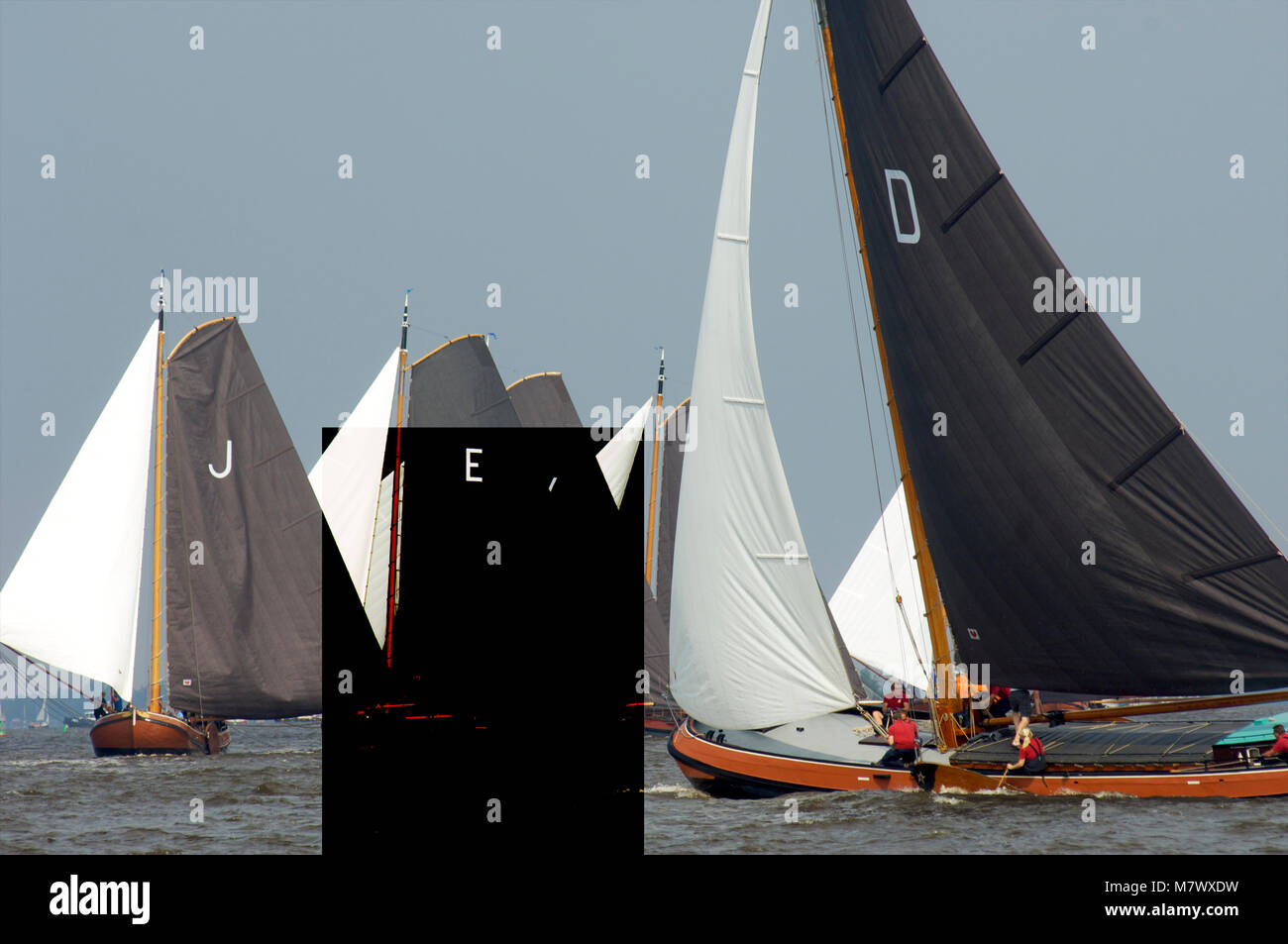 A traditional sailing race with classic Dutch wooden flat-bottemend ...