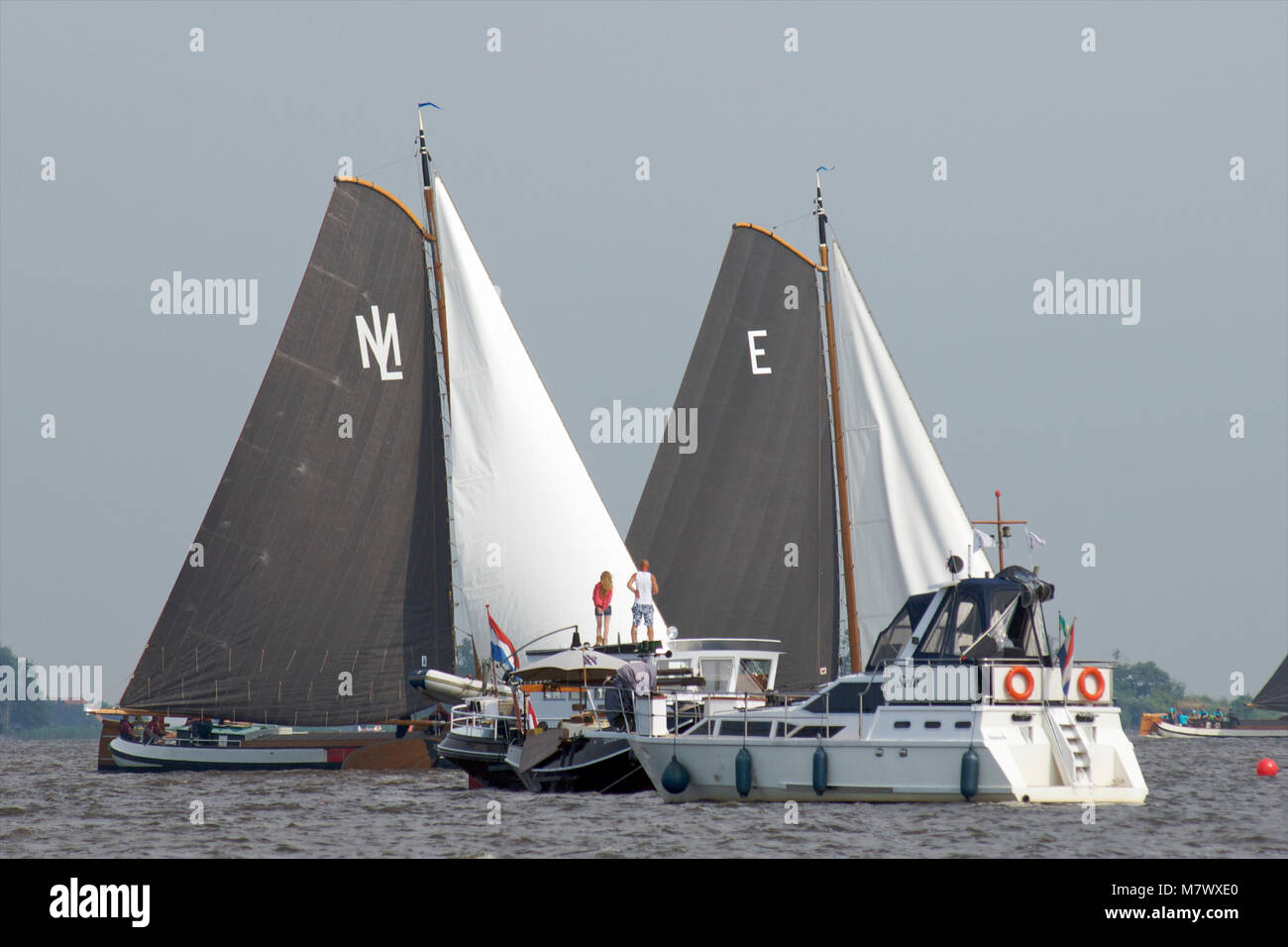 A traditional sailing race with classic Dutch wooden flat-bottemend ...