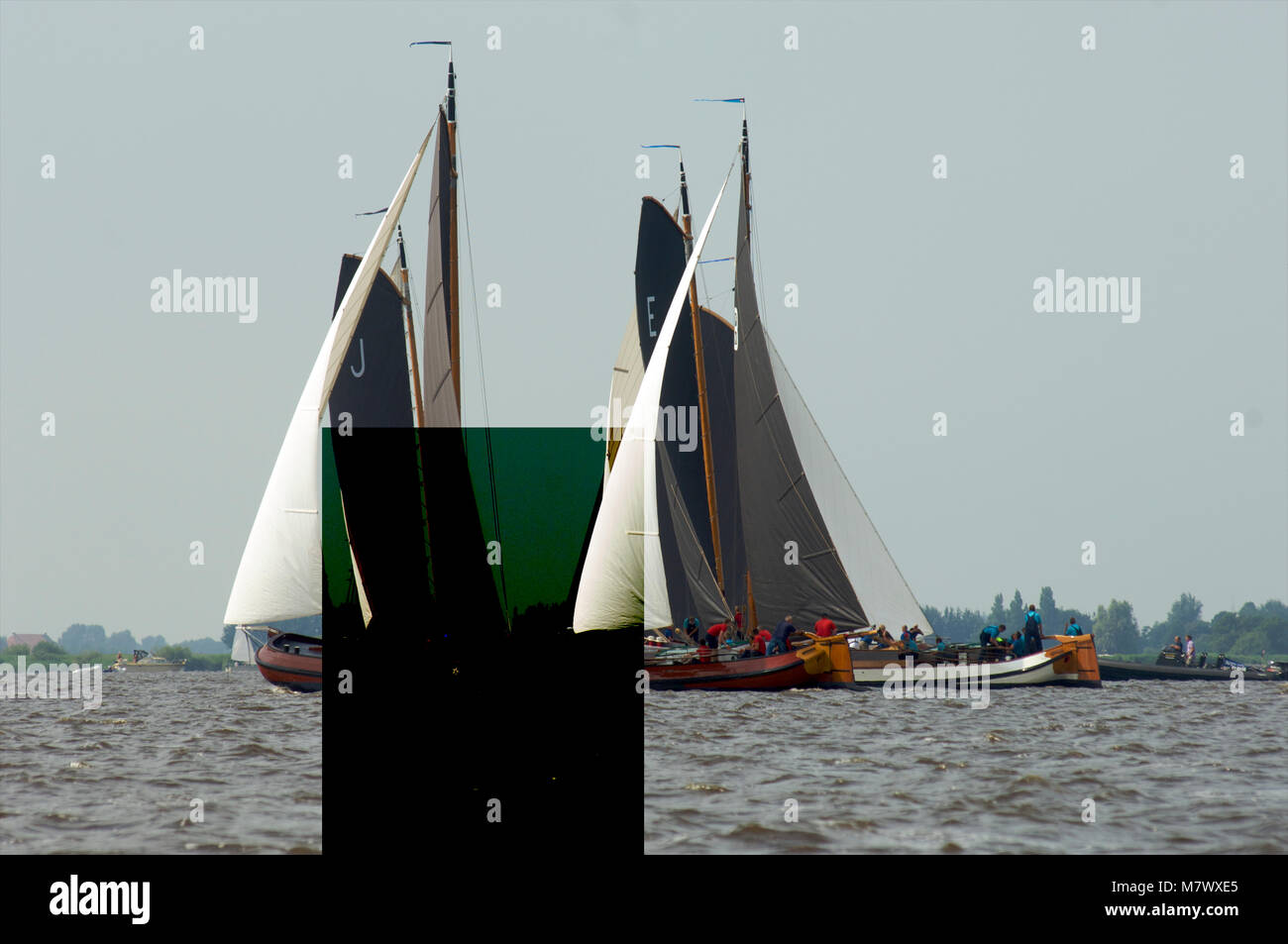 A traditional sailing race with classic Dutch wooden flat-bottemend ...
