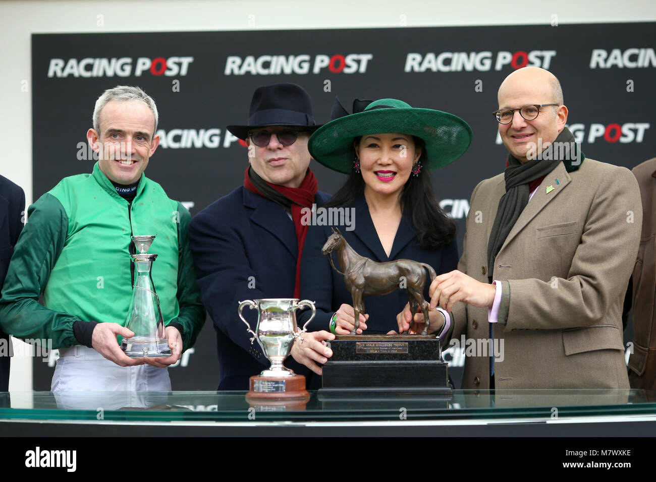 Jockey Ruby Walsh (left) and owner Mr Simon Munir collect the trophy ...