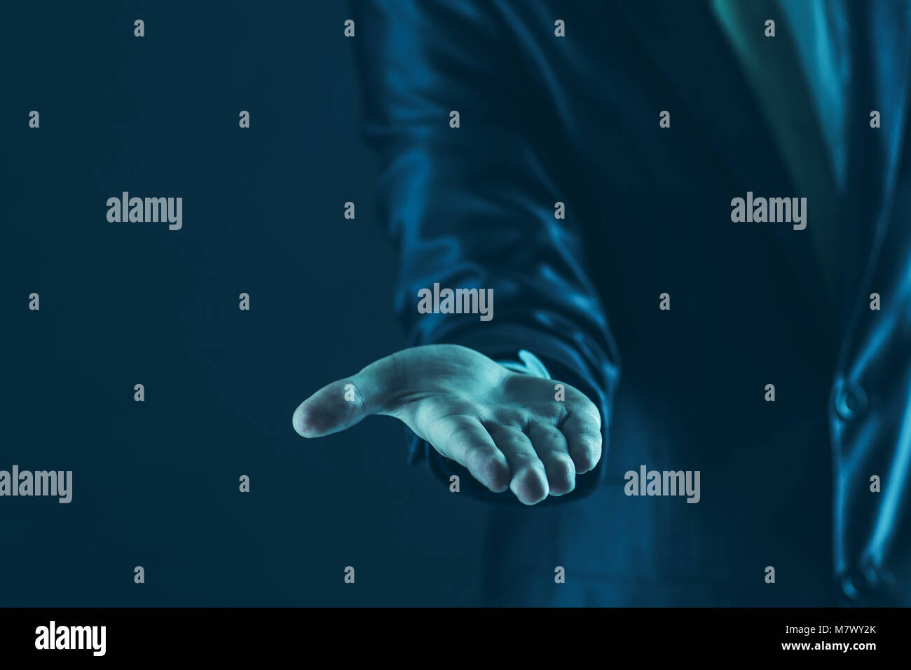 closeup of a businessman stands and extends a hand forward Stock Photo ...