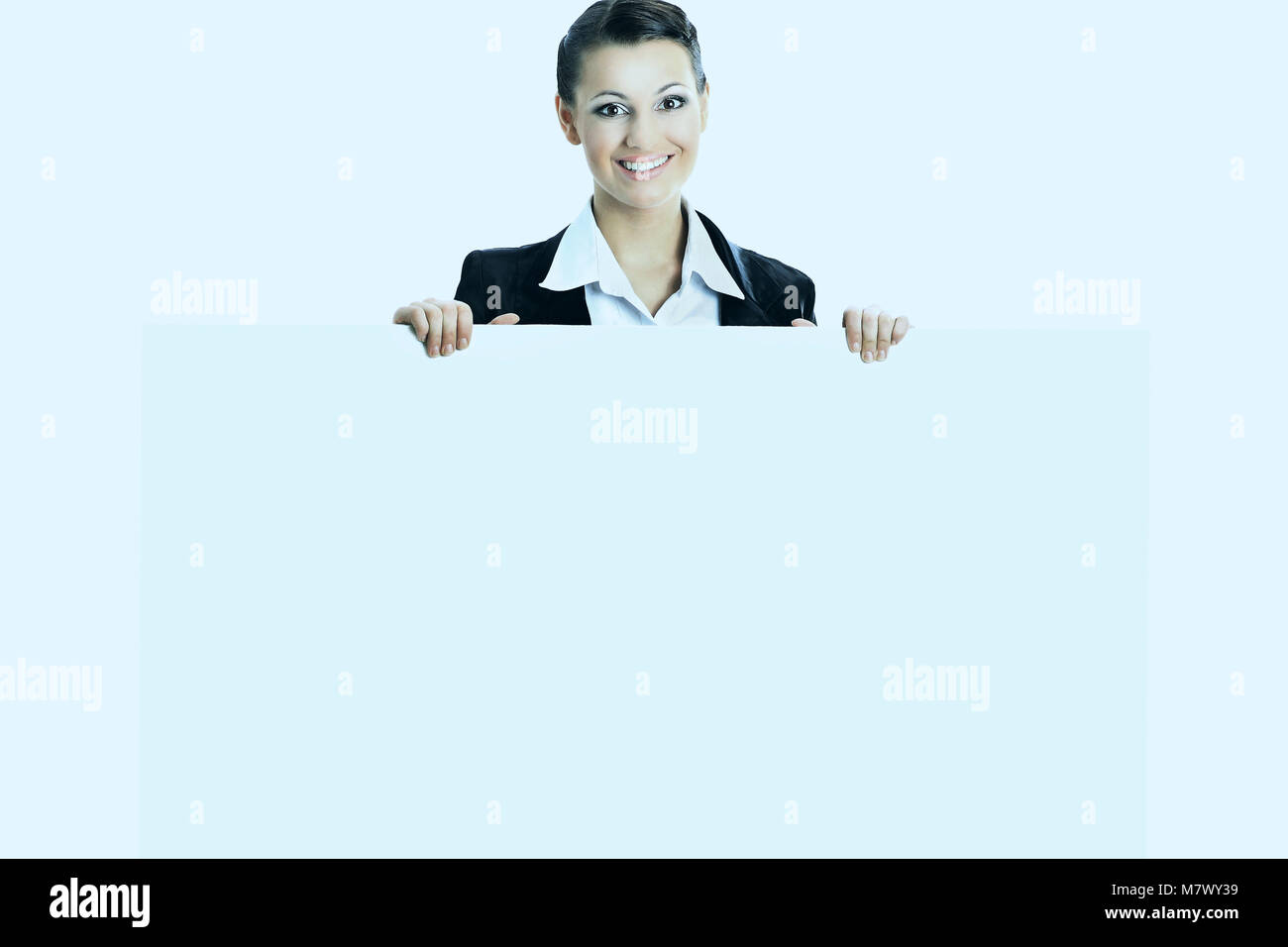 Beautiful business woman with a white banner. Isolated on white ...