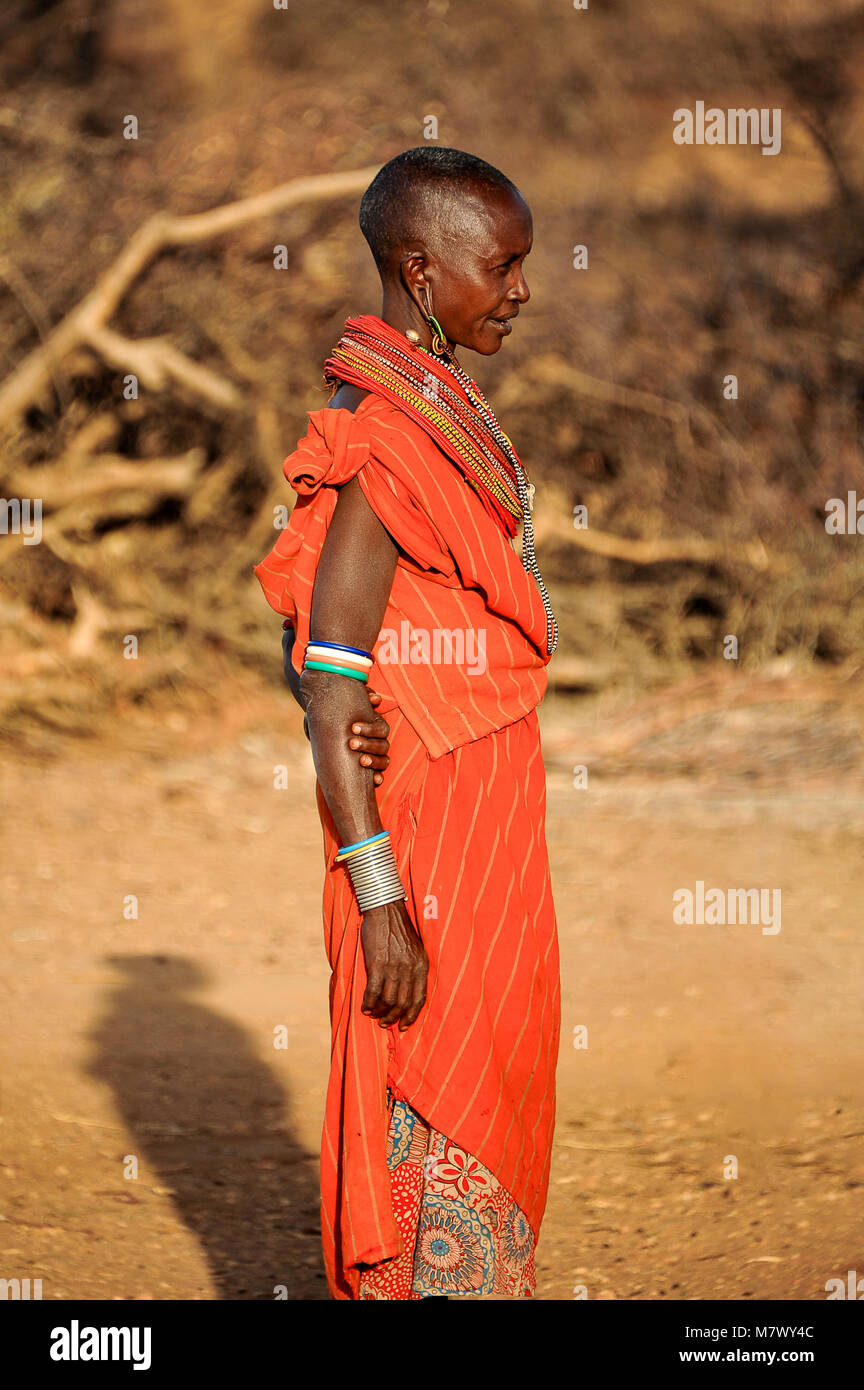Portrait of an African woman from the Samburu tribe in striking, orange ...
