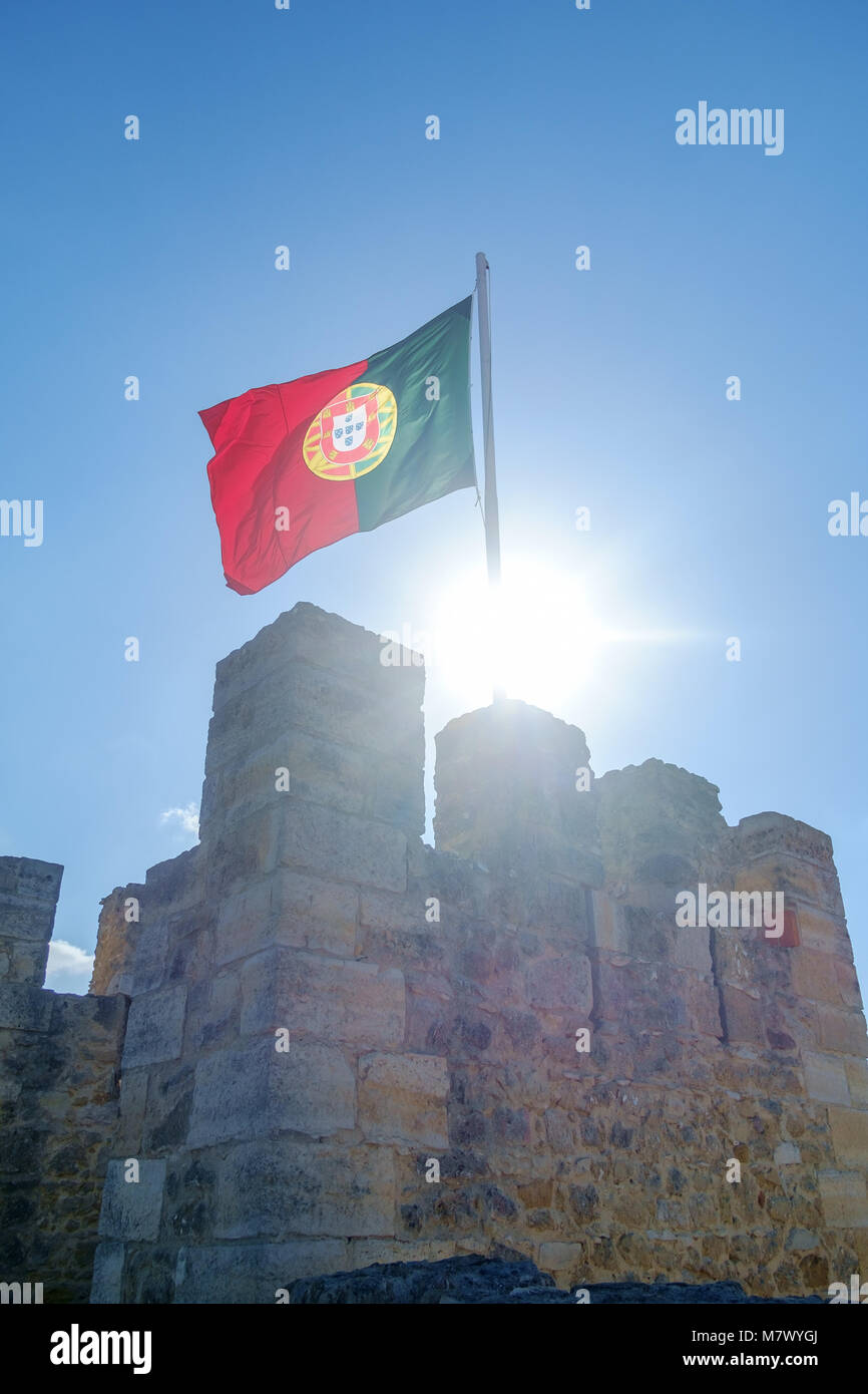 Portuguese flag streams over the battlements at Castelo de Sao Jorge ...