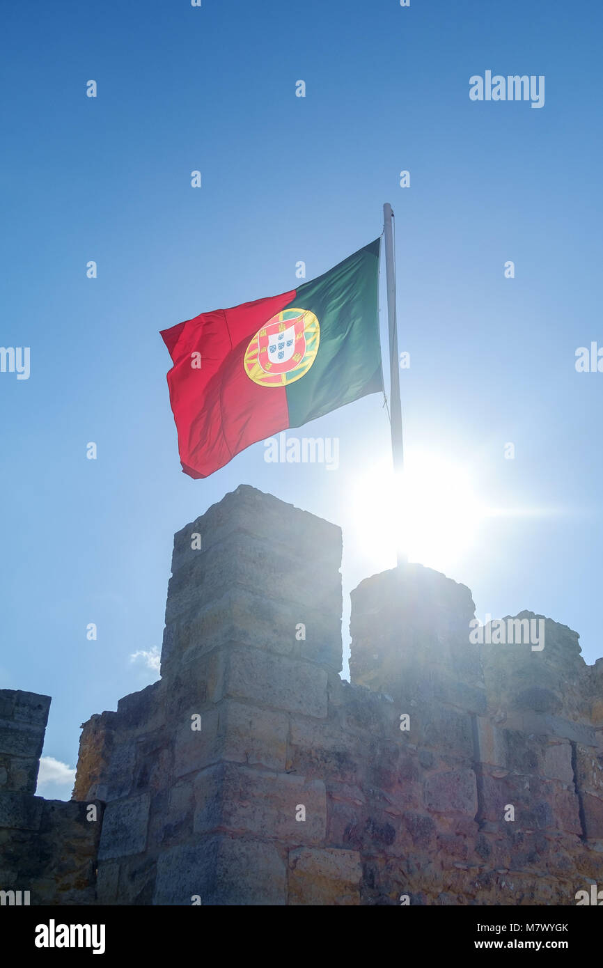 Portuguese flag streams over the battlements at Castelo de Sao Jorge ...