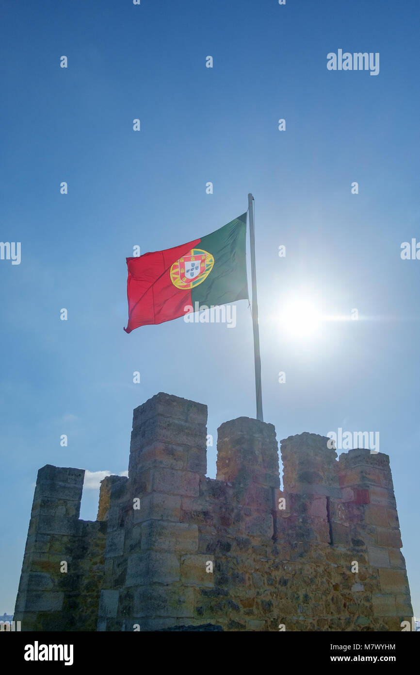 Portuguese flag streams over the battlements at Castelo de Sao Jorge ...
