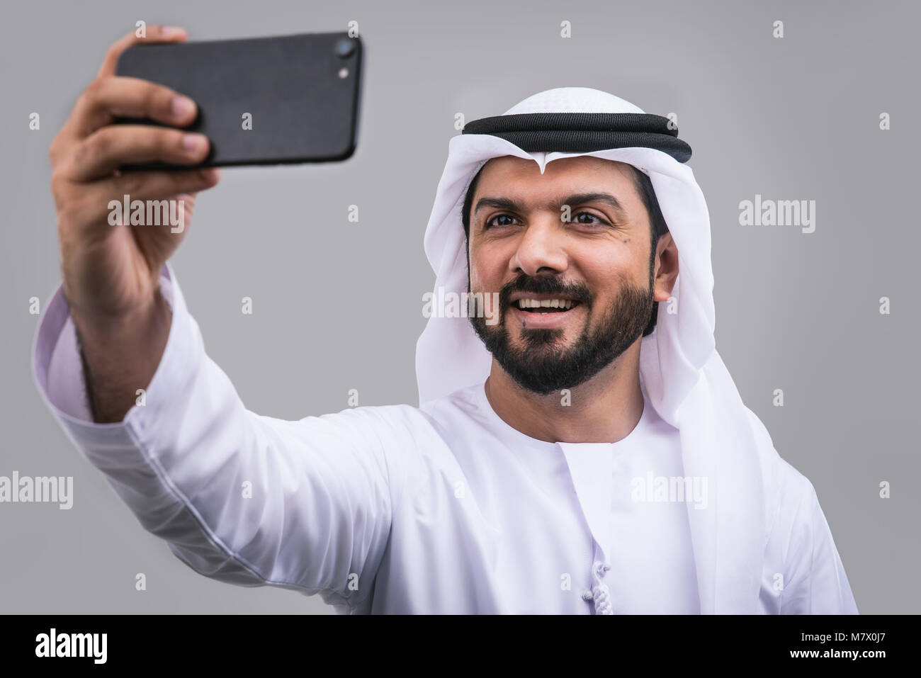 Arabic handsome man studio portraits Stock Photo - Alamy