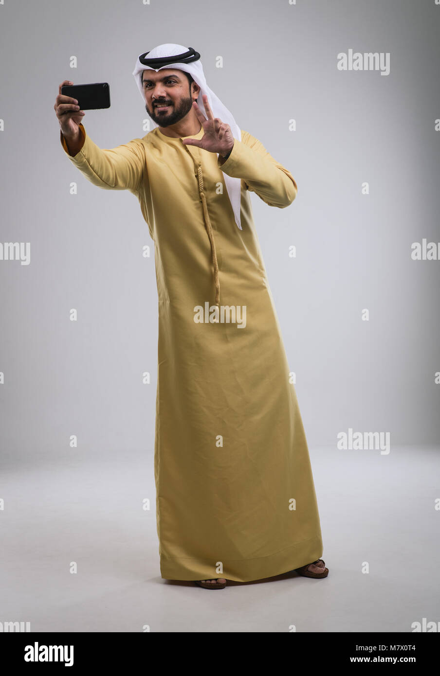 Arabic handsome man studio portraits Stock Photo - Alamy