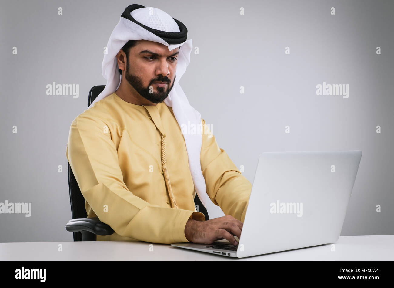 Arabic handsome man studio portraits Stock Photo - Alamy