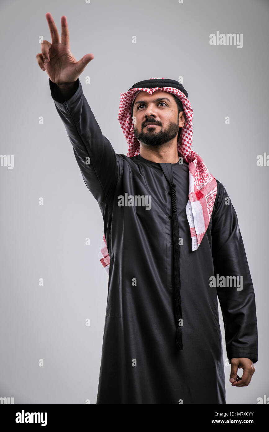 Arabic handsome man studio portraits Stock Photo - Alamy