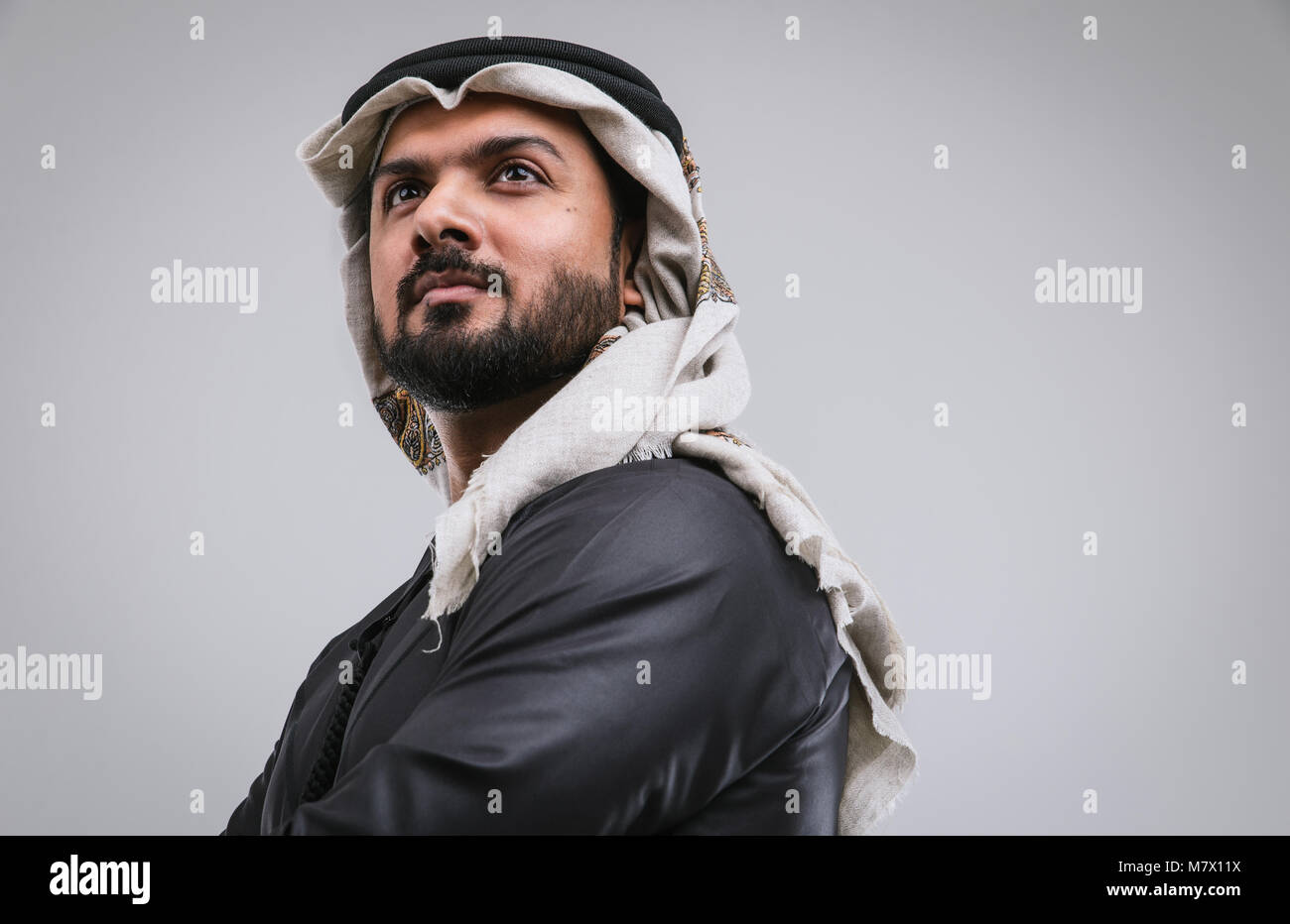 Arabic handsome man studio portraits Stock Photo - Alamy