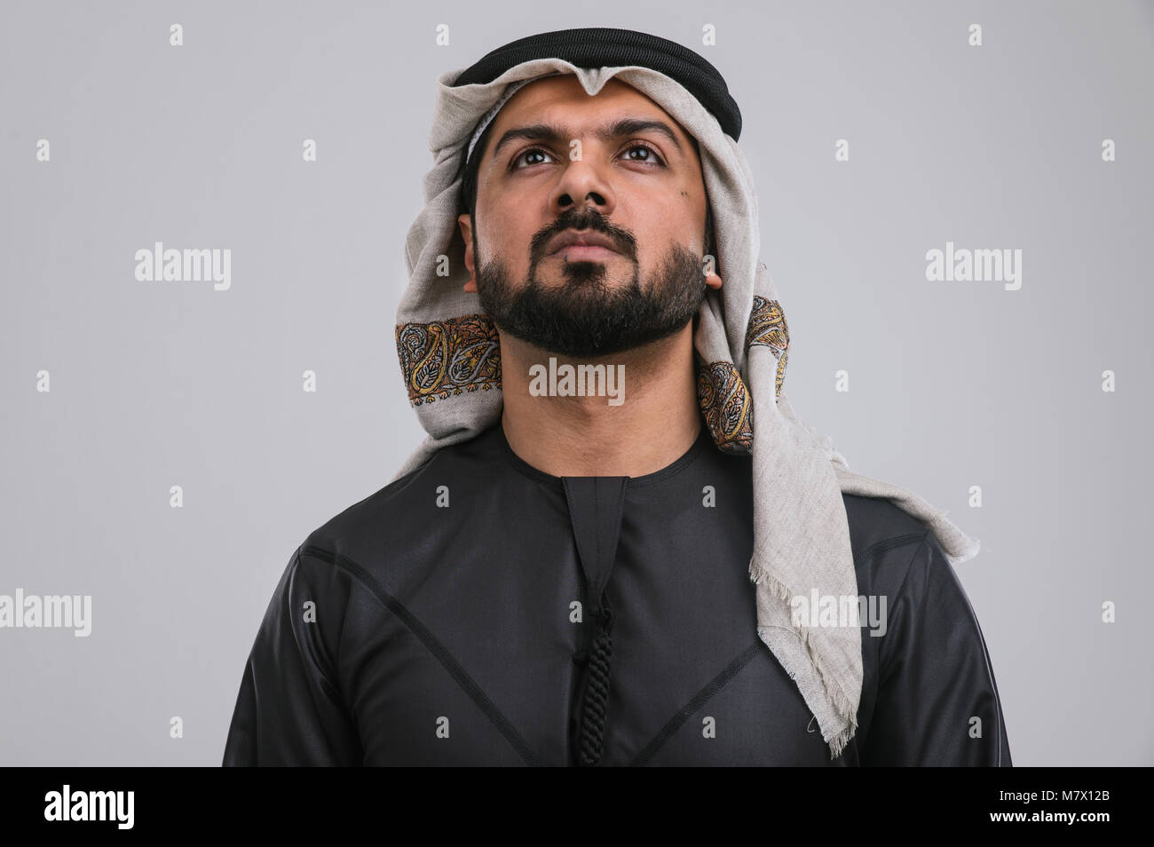 Arabic handsome man studio portraits Stock Photo - Alamy