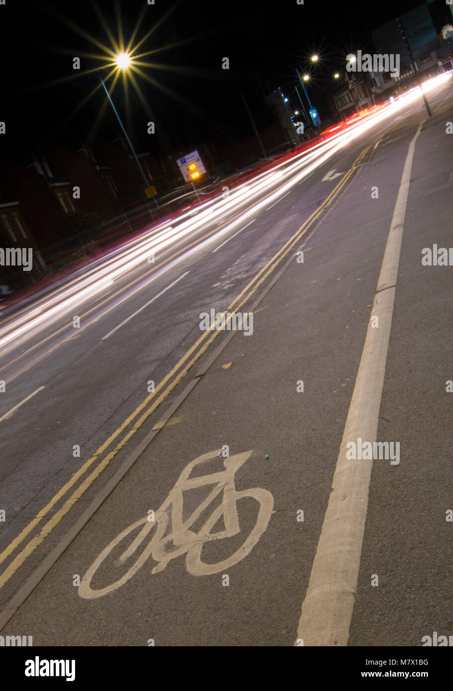 slow exposure from the middle of the road at night with vehicle lights ...