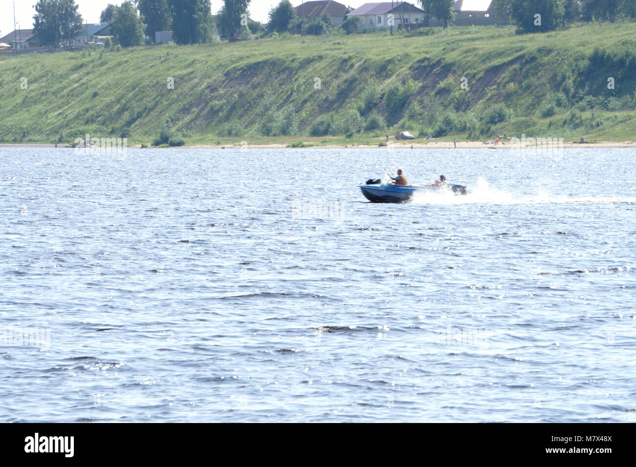 motor boat rides on the water Stock Photo - Alamy