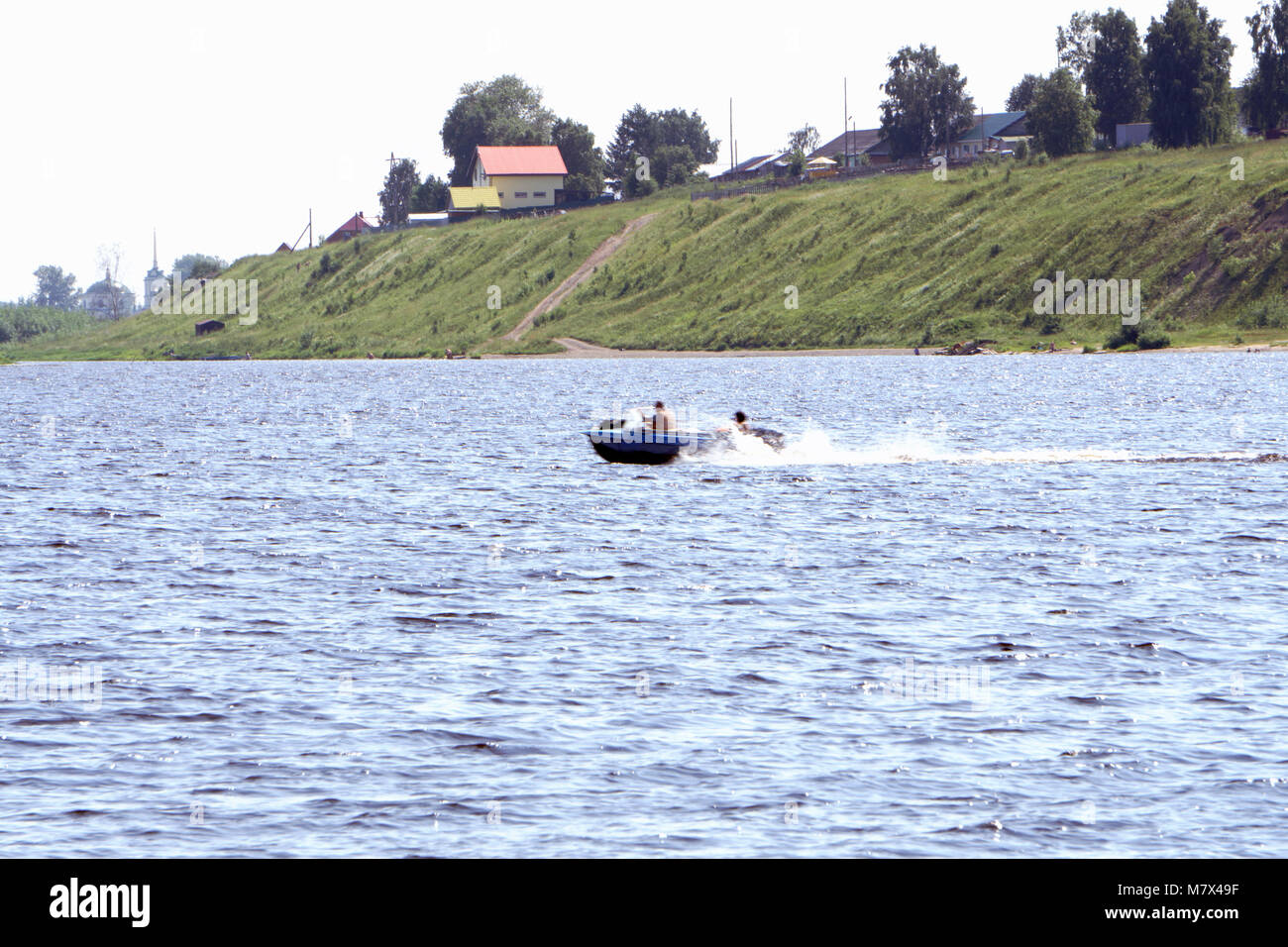 motor boat rides on the water Stock Photo - Alamy