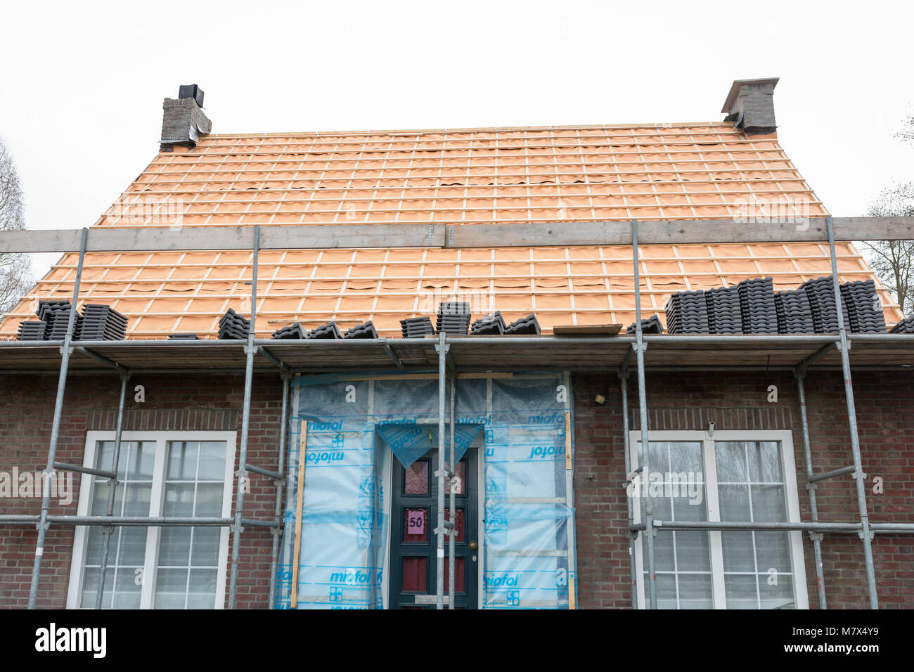 Renovation of house with new isolation and roof tiles ready to be ...