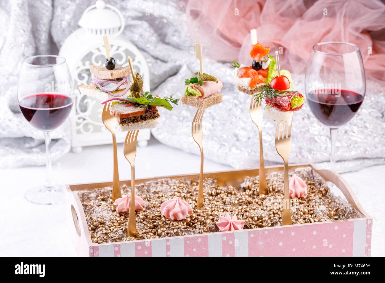 Original canapes on the forks. Appetizing still life. Close-up Stock ...