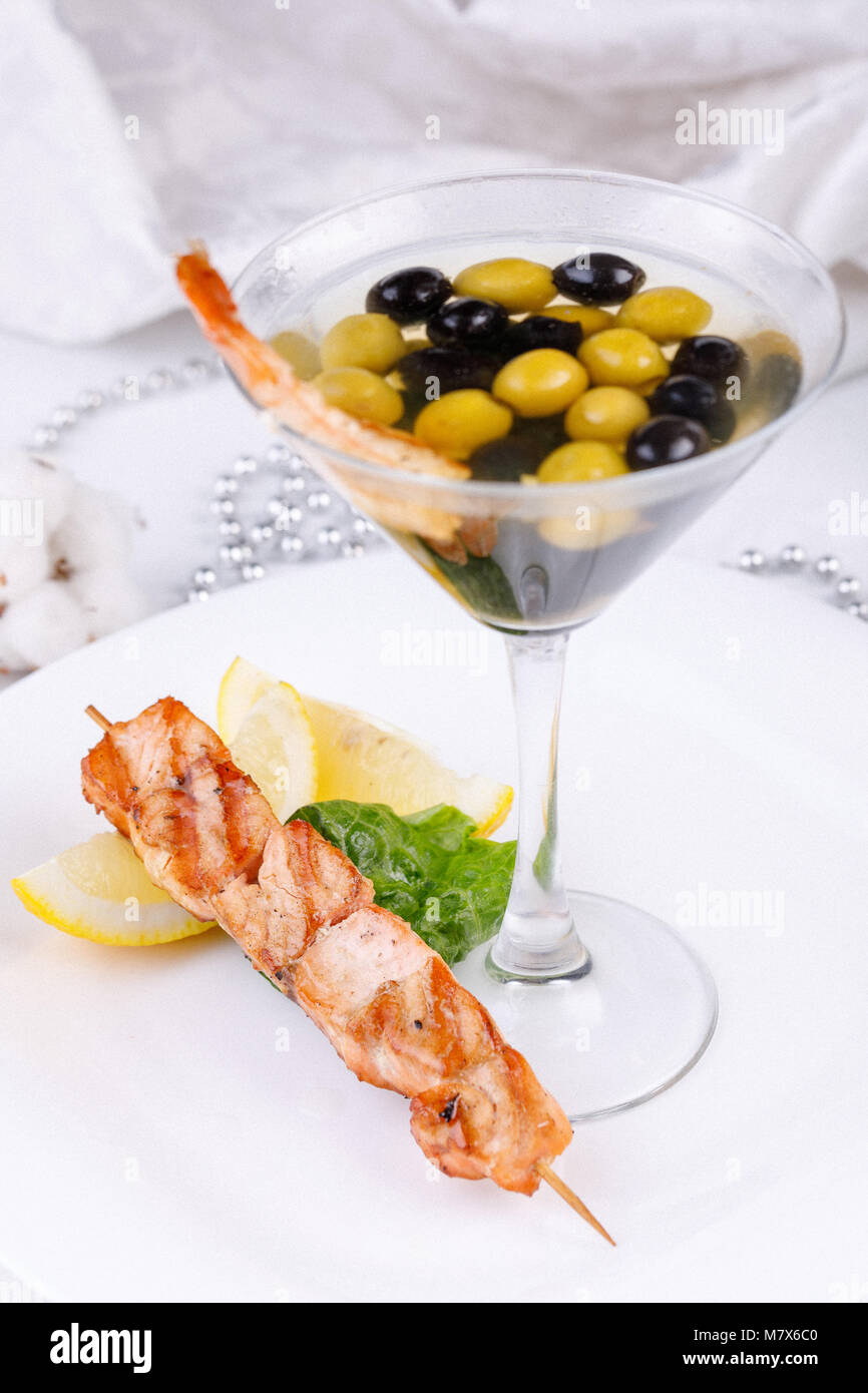 Cold snack from shrimps and fish shish kebab with original serving of ...