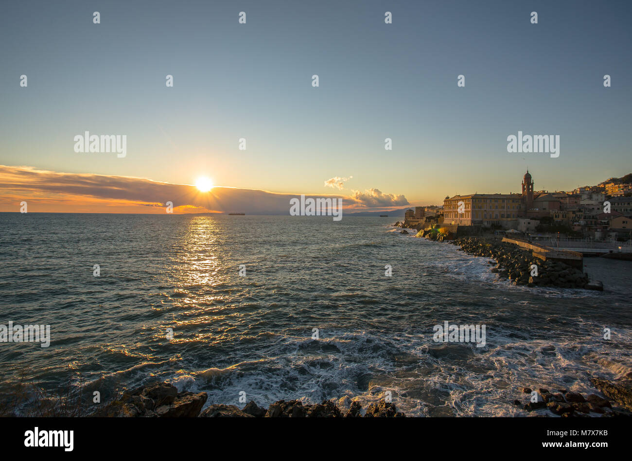 Sunset at the seaside in the village of Genoa Nervi, Italy with ...