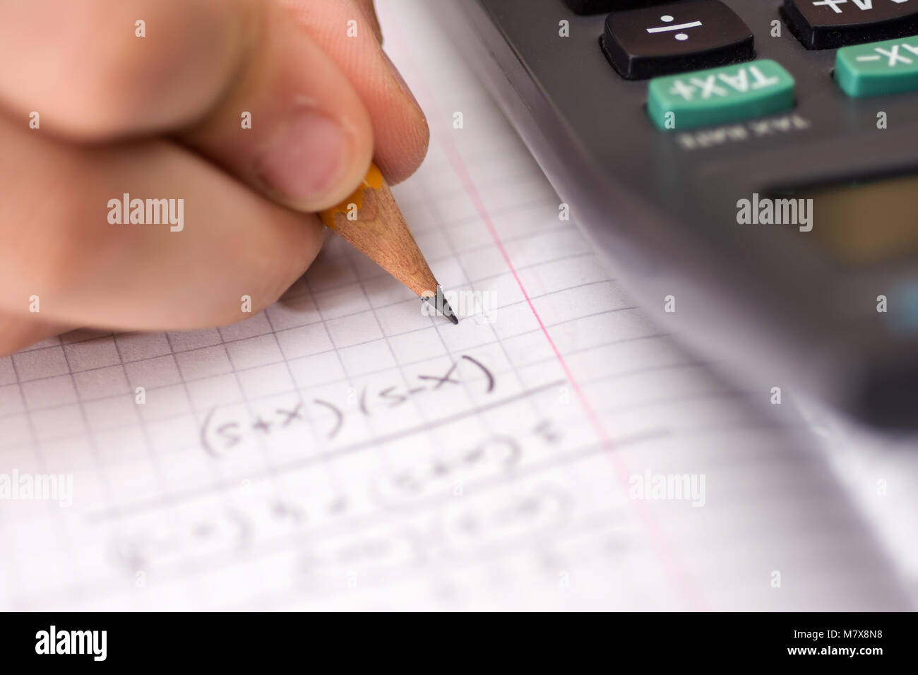 Child Holds the Pencil in his Hand and Solves Mathematical Problems ...