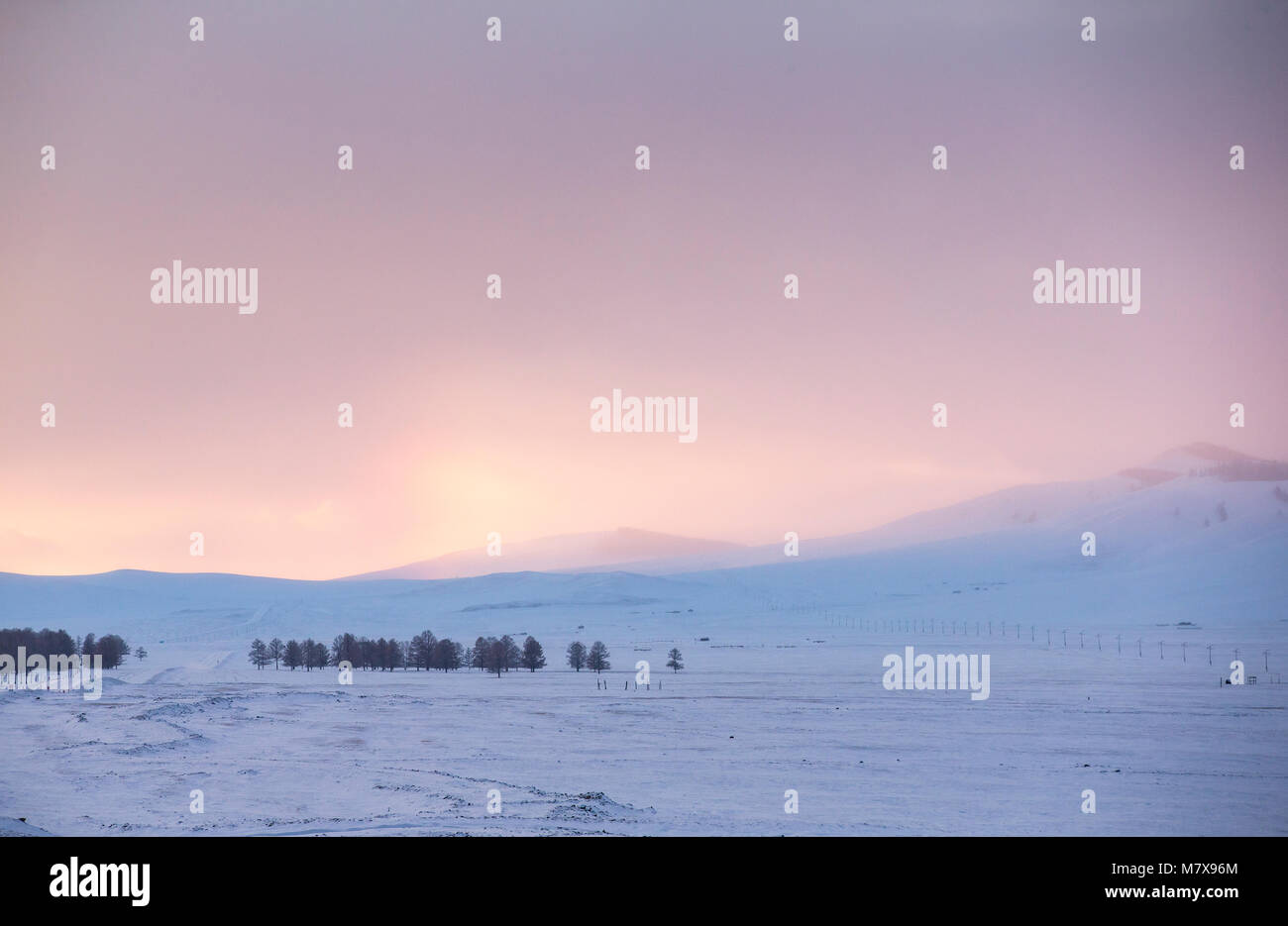 sunset in a snowy northern Mongolian landscape Stock Photo - Alamy