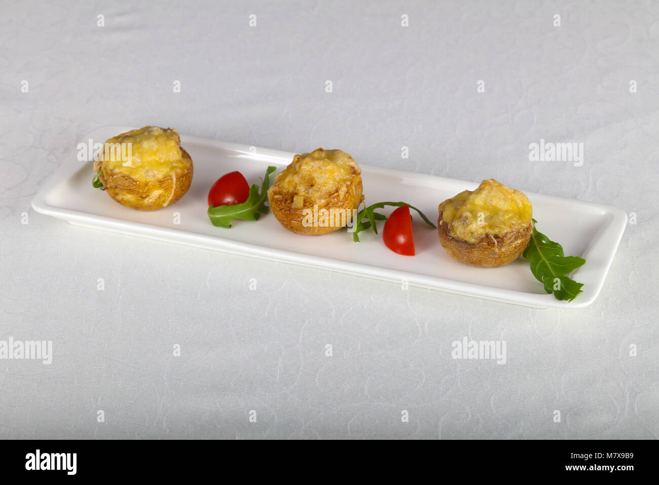 Baked mushrooms champignon with cheese Stock Photo - Alamy