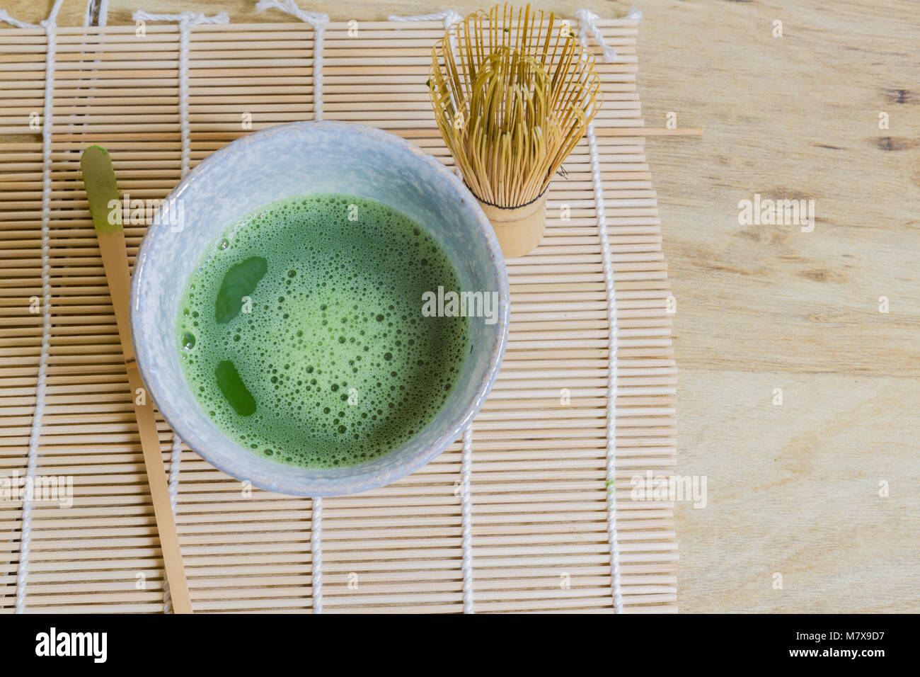Above view of Japanese tea ceremony elements including a stone bowl of ...
