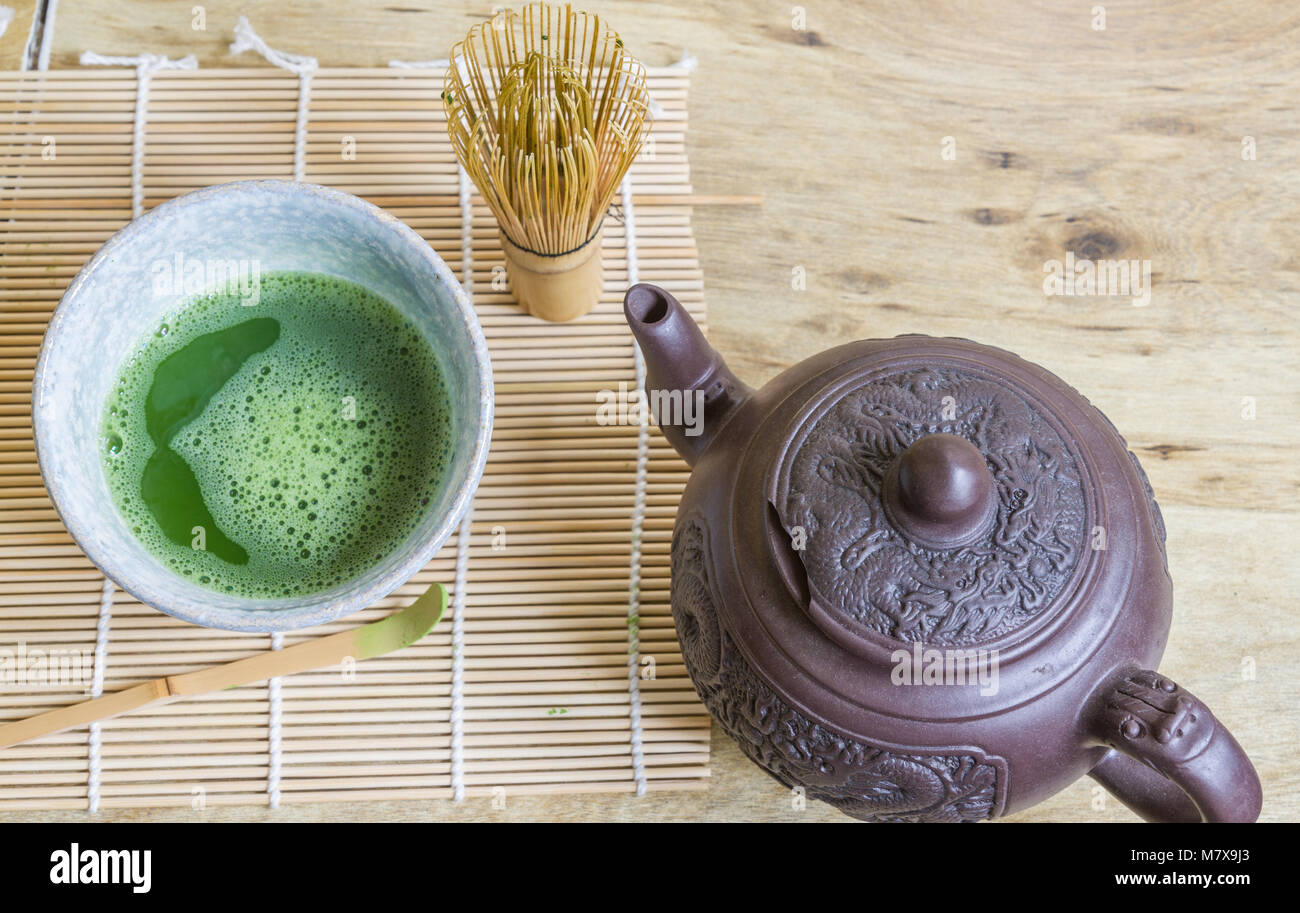 Above view of Japanese tea ceremony elements including a stone bowl of ...