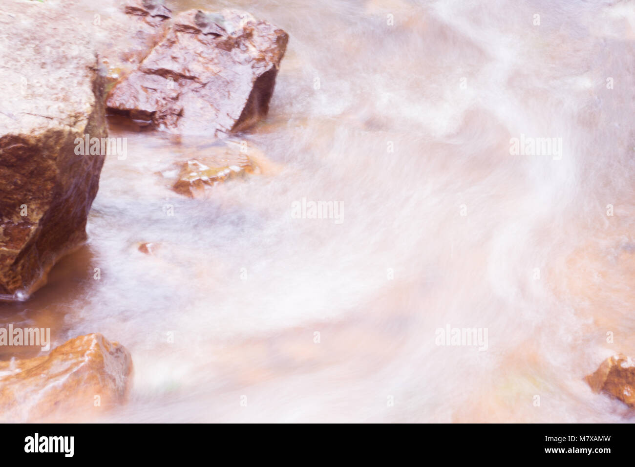 River flow, fast water flow forms a lot of foam and bubbles, abstract ...
