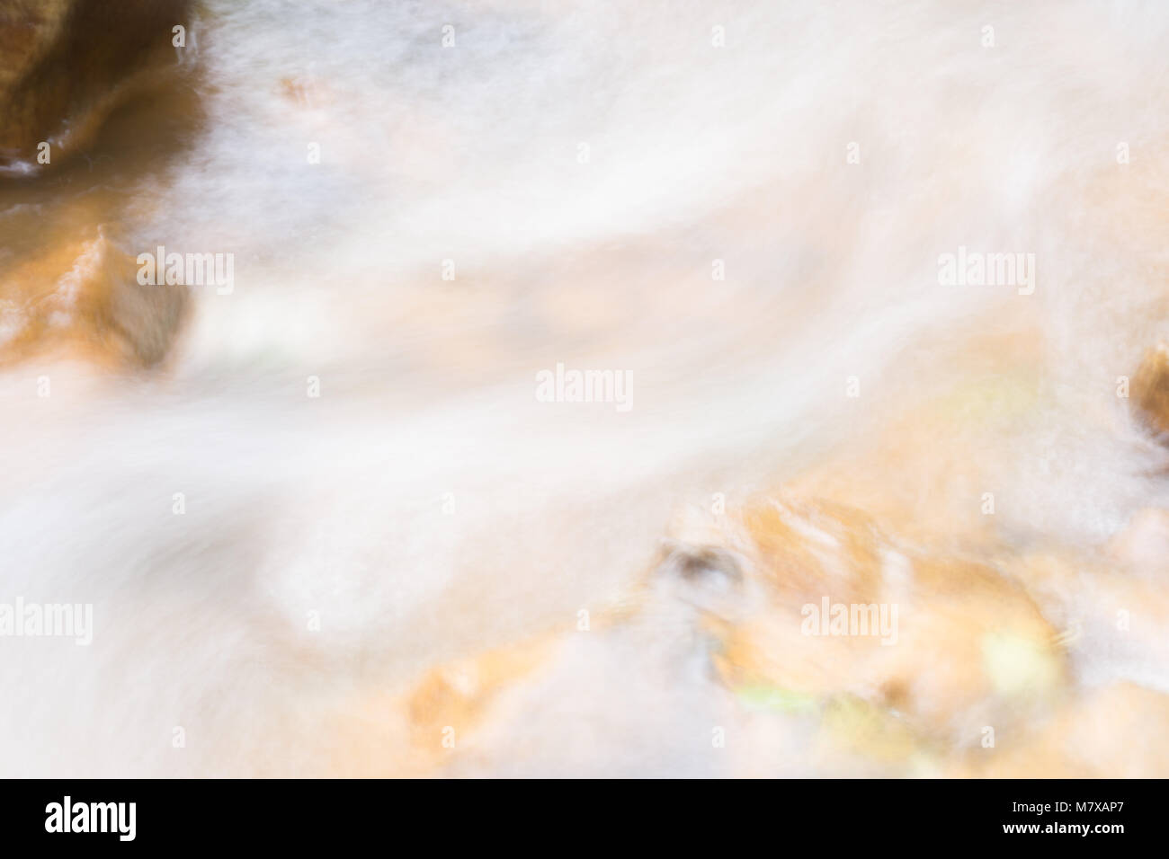 River flow, fast water flow forms a lot of foam and bubbles, abstract ...