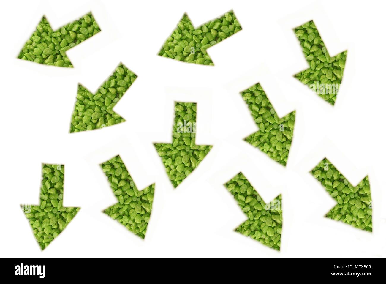 Many green arrows made of split stones mixed up Stock Photo - Alamy