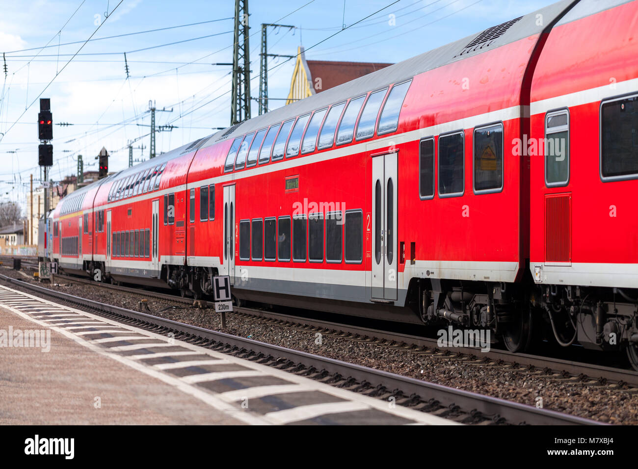 a german train passes a train station Stock Photo - Alamy