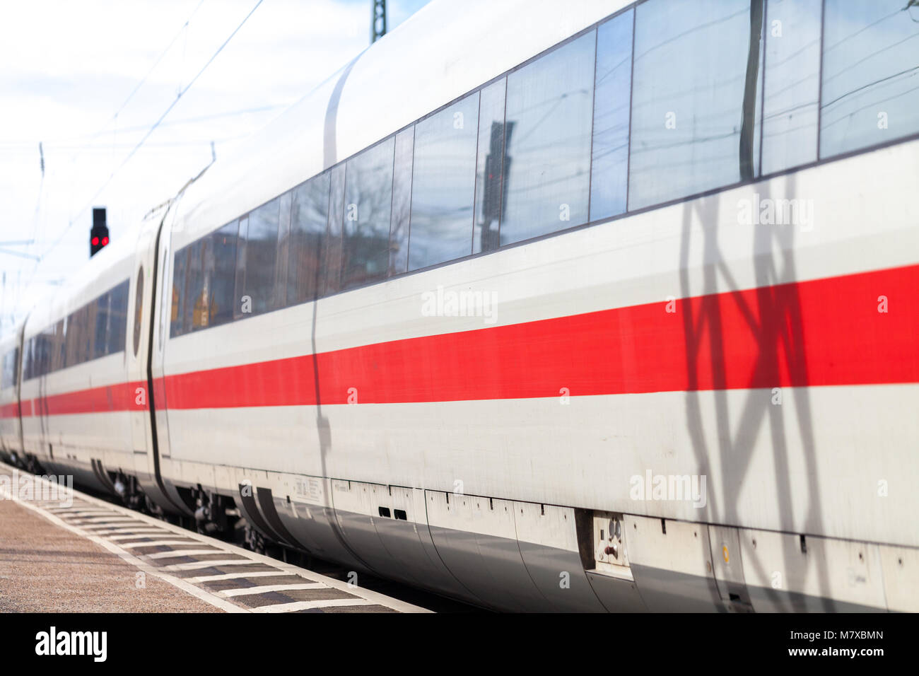 a german train passes a train station Stock Photo - Alamy