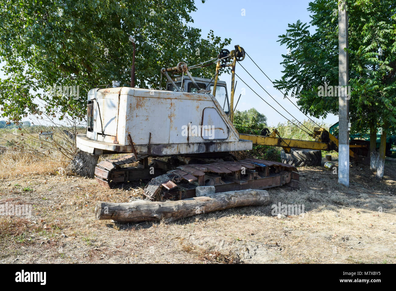 Old quarry near the dragline. Old equipment for digging the soil in ...