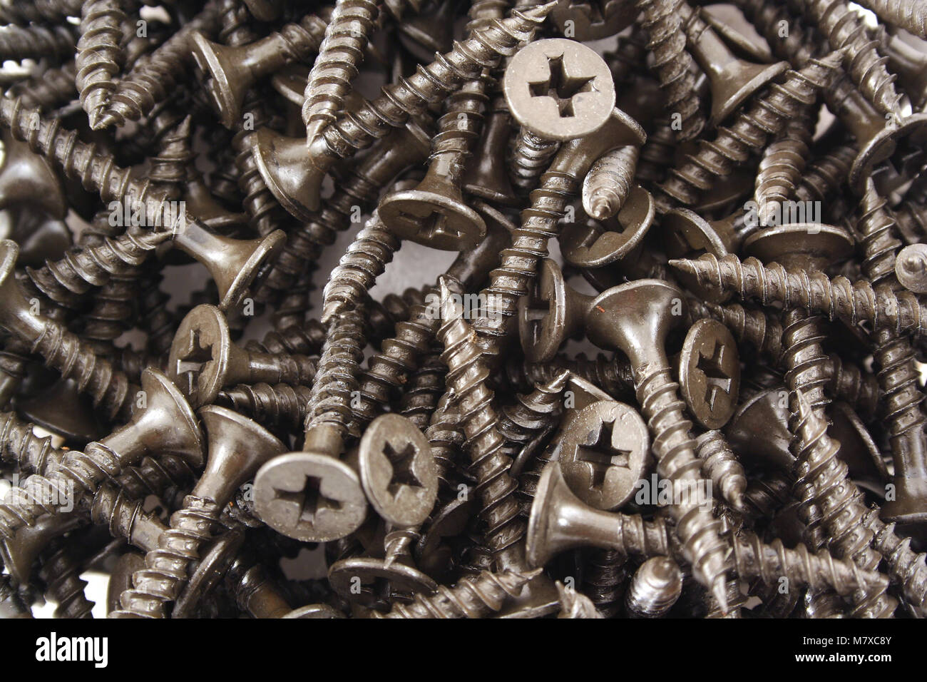 A Black Screws background texture Stock Photo - Alamy