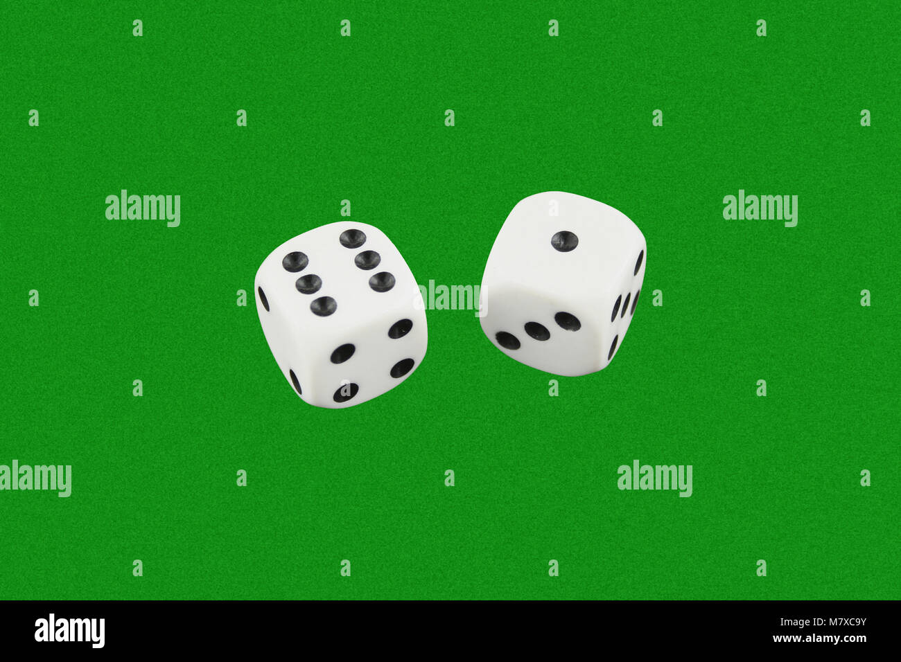 Seven and seven dice isolated on black background Stock Photo - Alamy