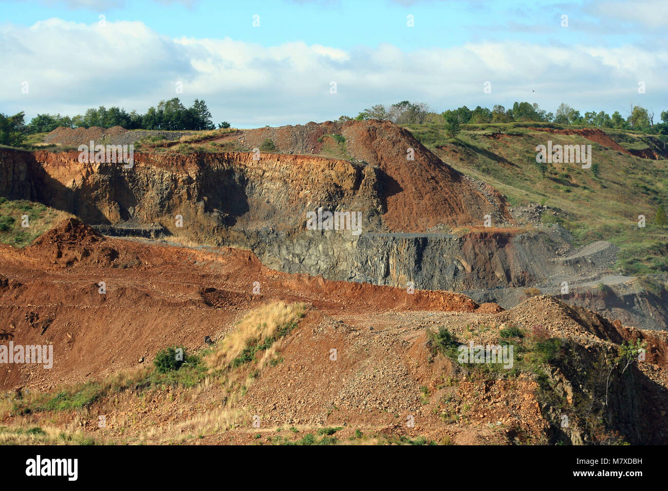 A Rock Quarry dug out mountain side Stock Photo - Alamy