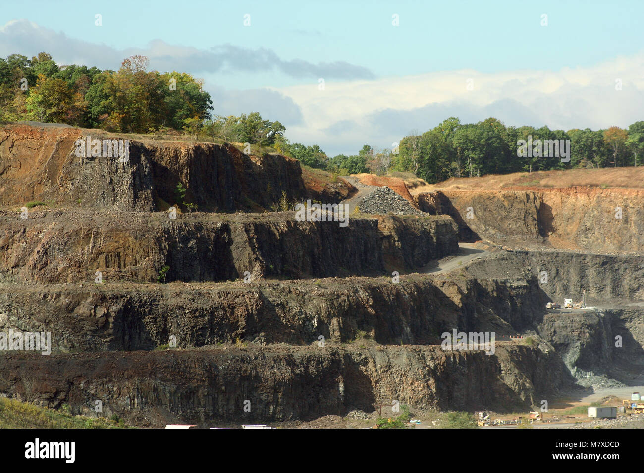 A Rock Quarry dug out mountain side Stock Photo - Alamy