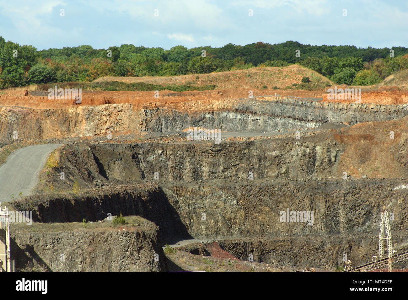 A Rock Quarry dug out mountain side Stock Photo - Alamy