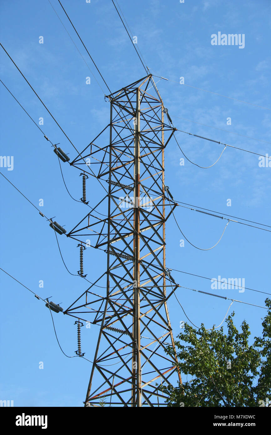 High tension power lines against blue sky Stock Photo - Alamy