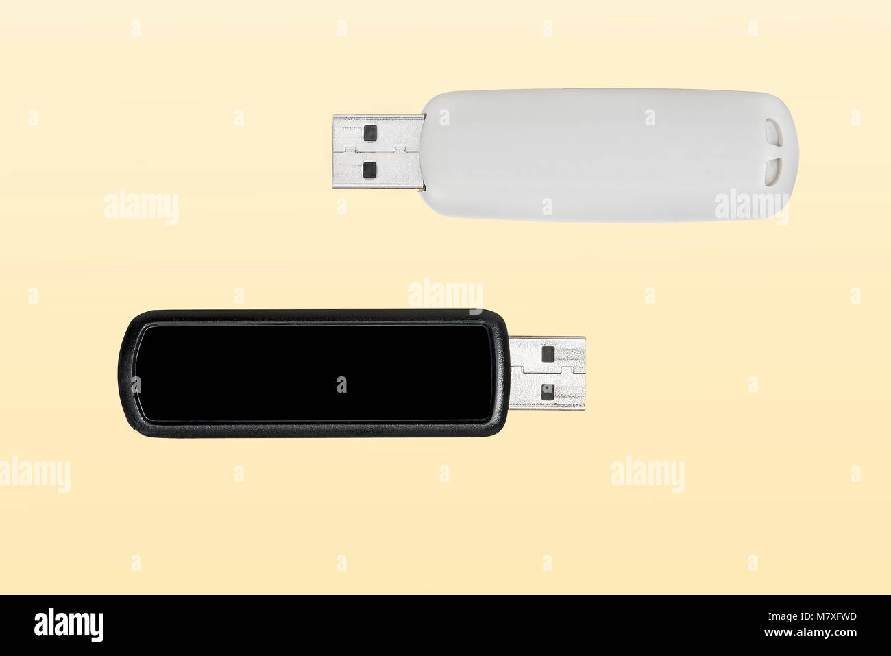 Two USB flash drives on yellow background Stock Photo - Alamy