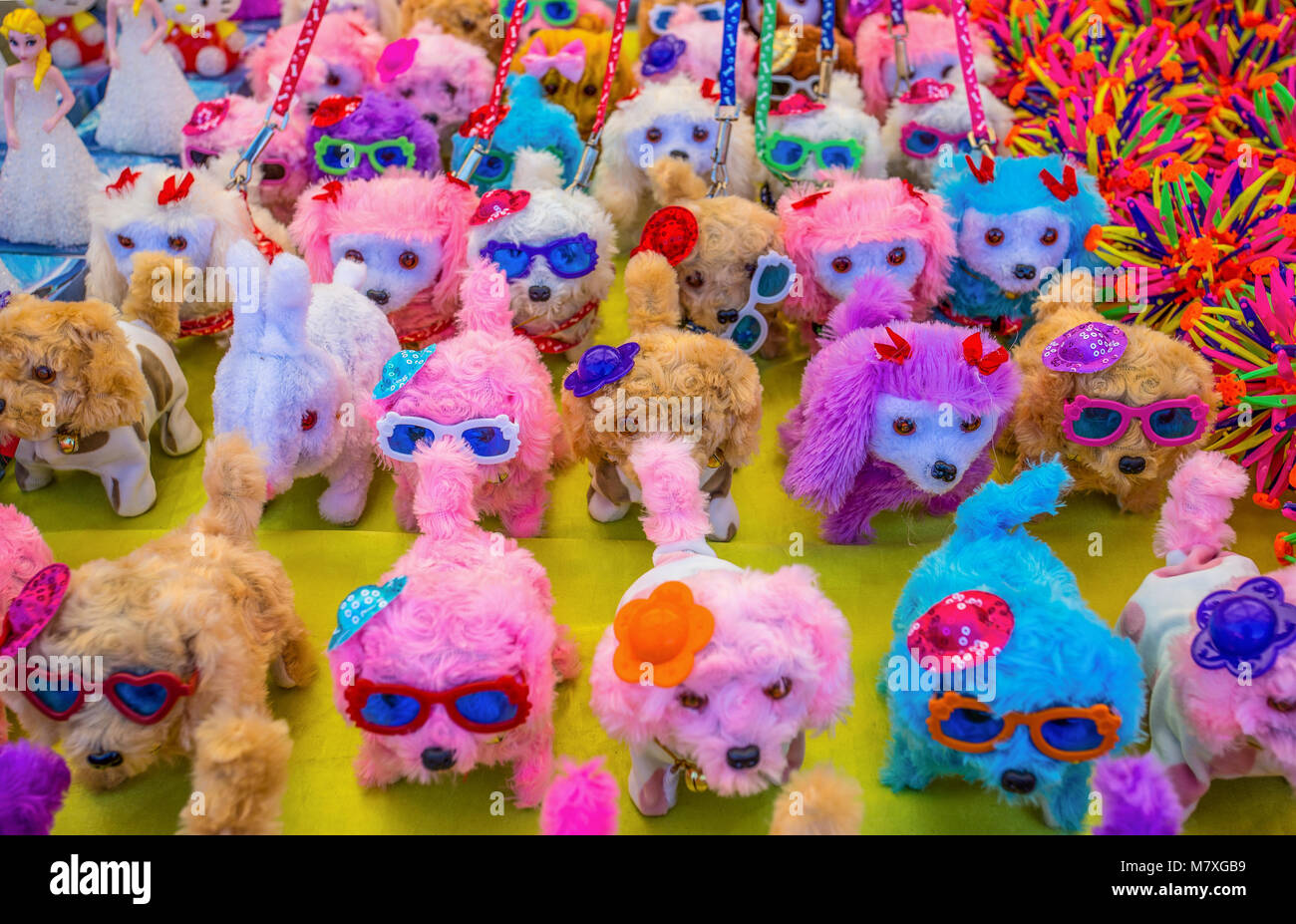 Cute dogs dolls on sale at the market Stock Photo - Alamy