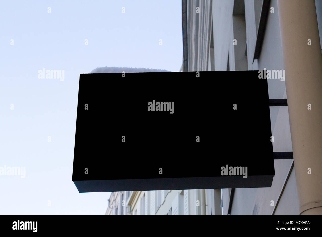 Black restangular signboard on the wall. Mock up Stock Photo - Alamy