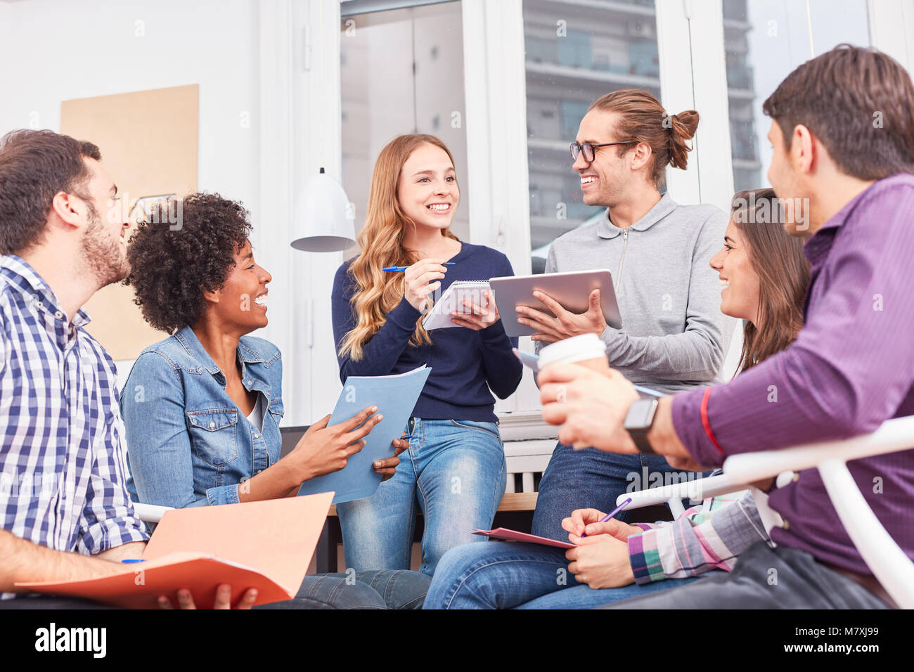 Group students discussing the strategy in the Business Start-Up Meeting ...