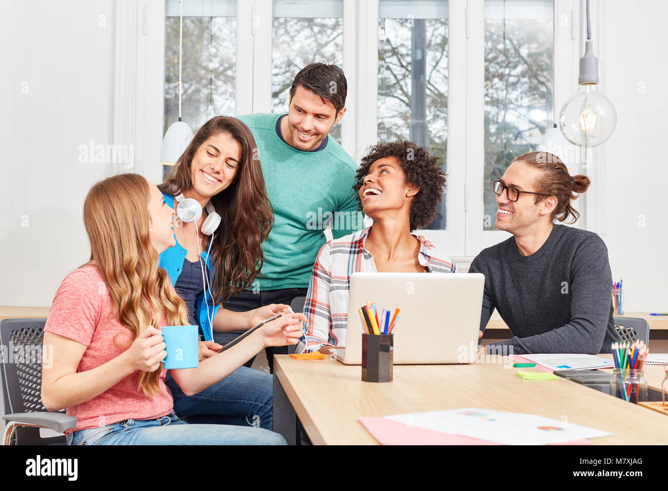 Group students as successful internet start-up team in a meeting Stock ...