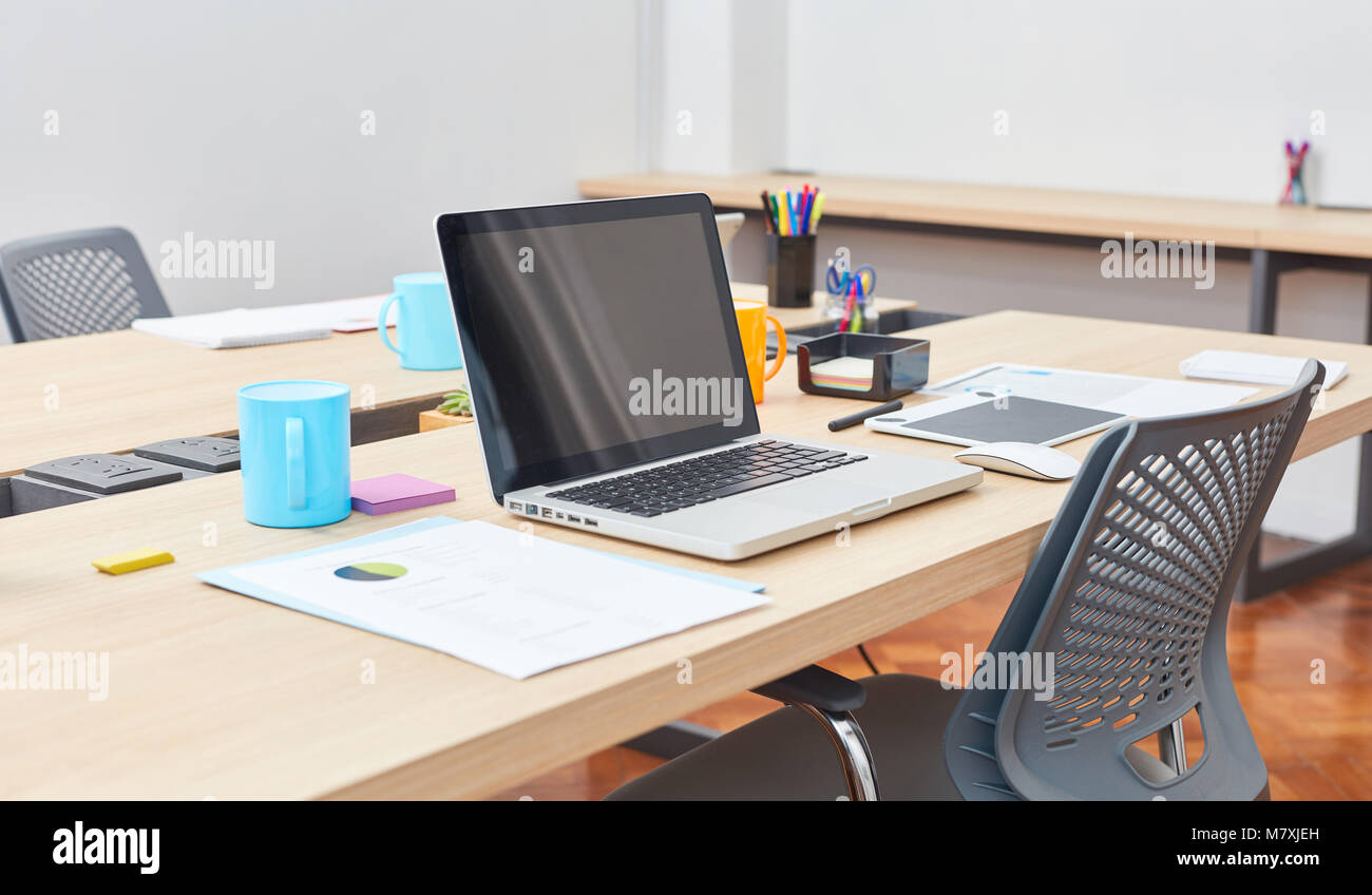 Computer Workplace with Laptop PC in a Coworking Space Stock Photo - Alamy